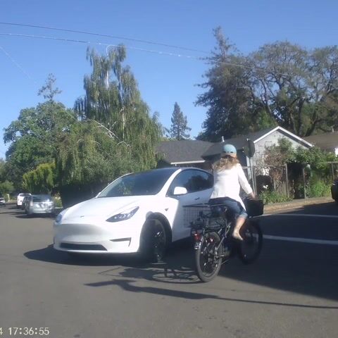 TESLA w no front plate (CVC §5200) turns into cyclists, violates CVC ...